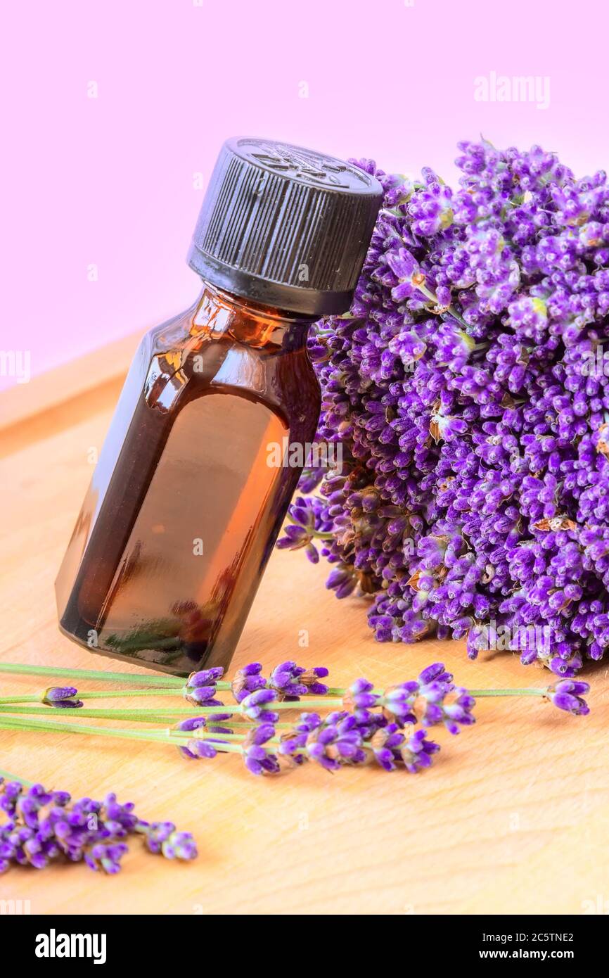 Lavender essential oil bottle with fresh flowers, beauty treatment ...