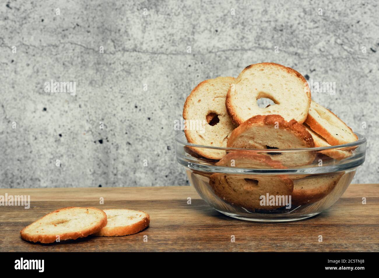 Bread, round crackers on a wooden stand with sauces. Ready meal from ...