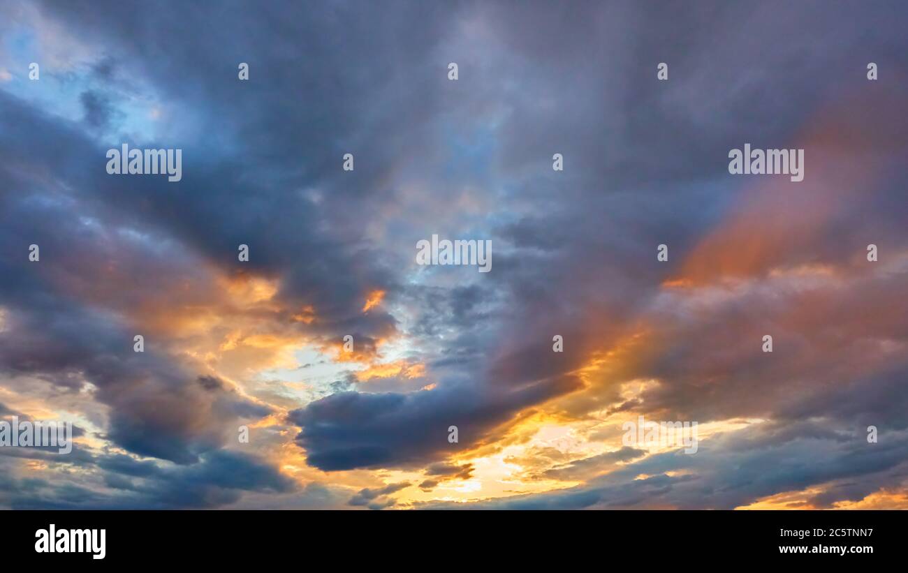 Sky with clouds of different colours at sunset, may be used as ...