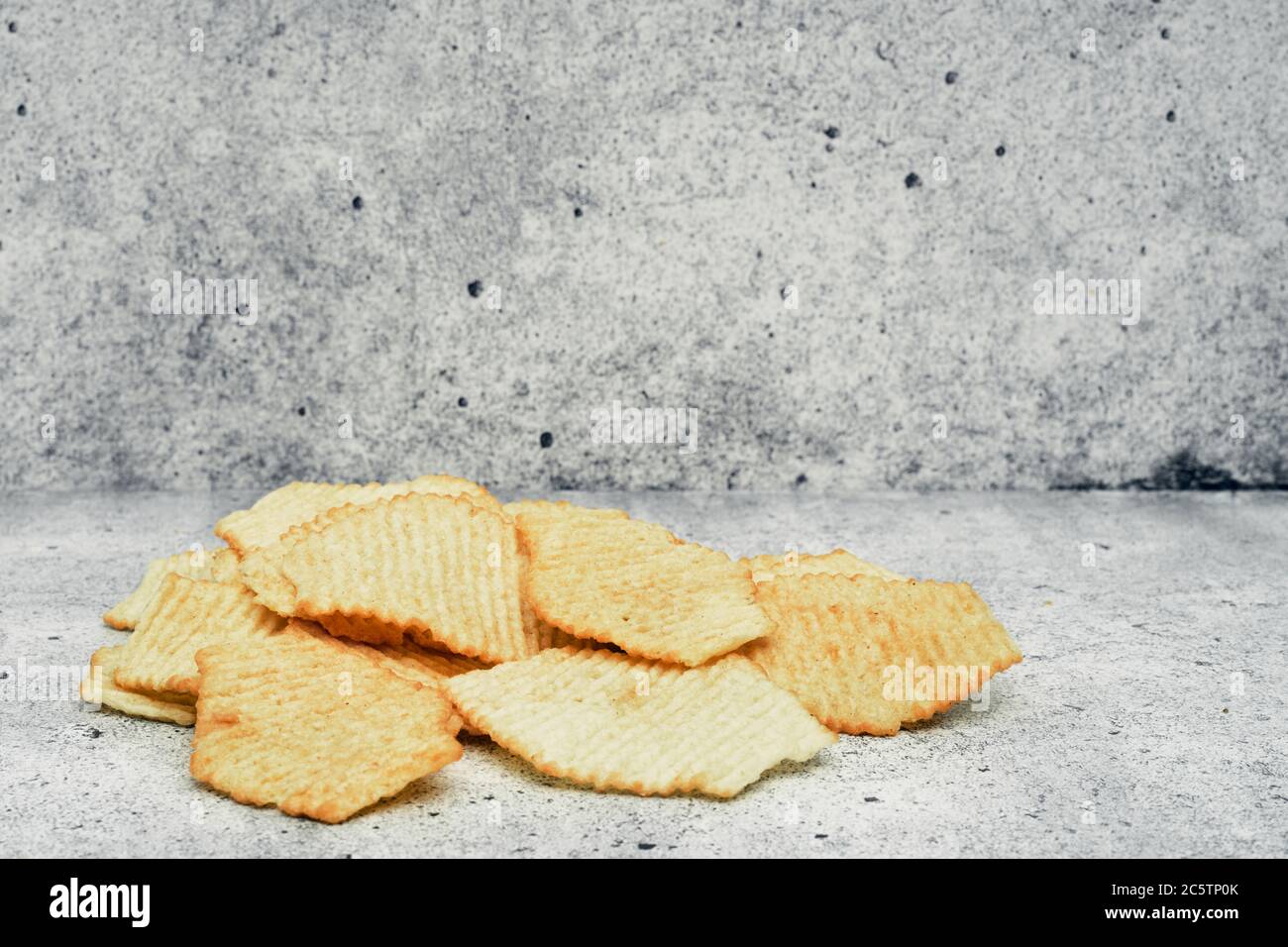Corrugated Potato Chips. Snack, junk food. Close up Stock Photo - Alamy