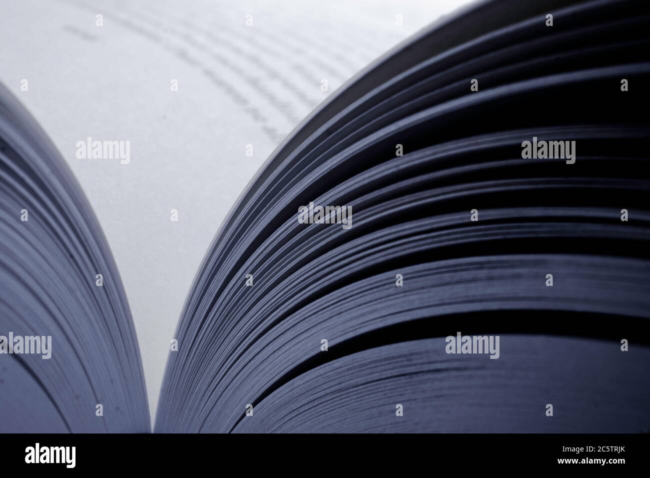 Open book with narrow depth of field. Focus on right side of papers ...