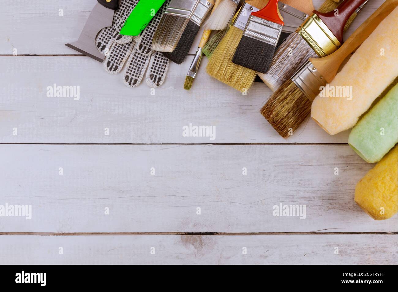 Painting tools various paint brushes roller on the wooden table Stock ...