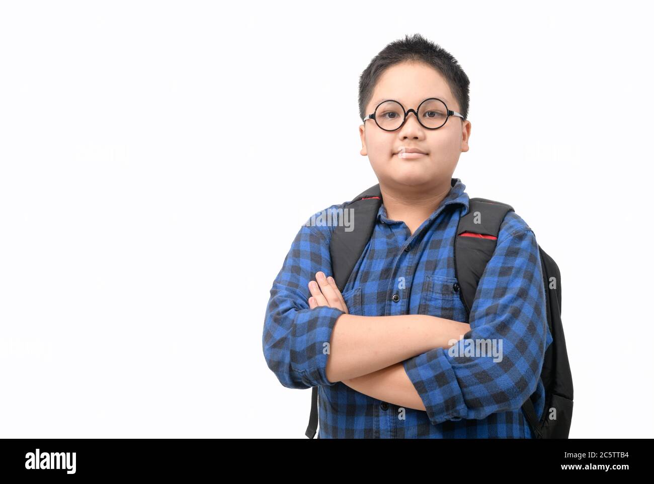 Portrait of smart boy student wear eye glasses and carries school bag ...