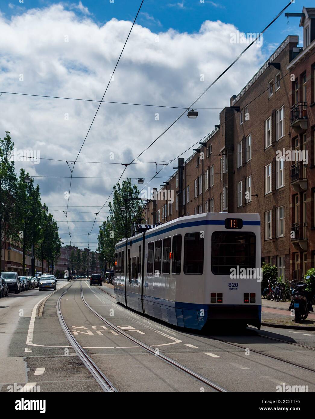 AMSTERDAM, THE NETHERLANDS JULY 1 2020: Tram line 13 traveling down the ...