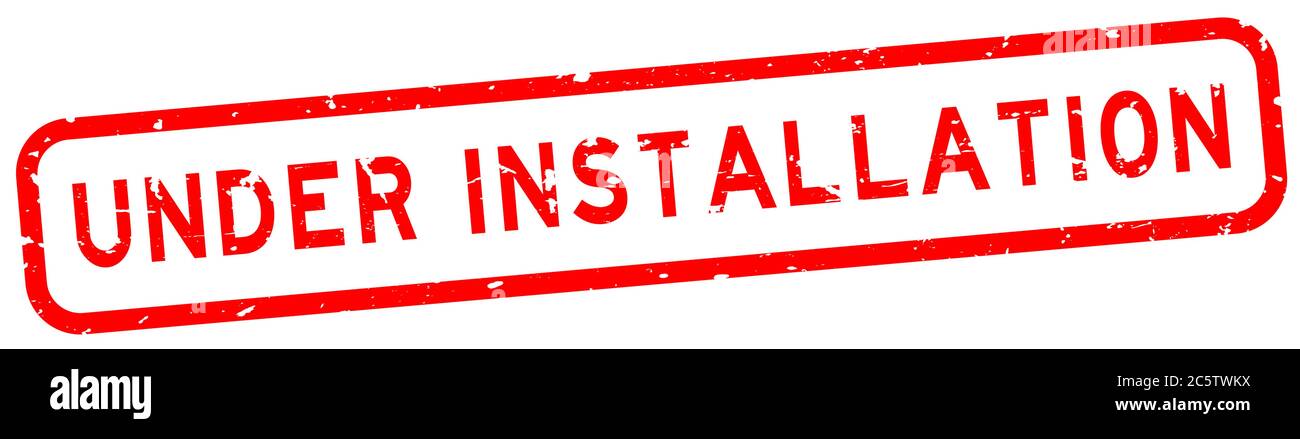 Grunge red under installation word square rubber seal stamp on white ...