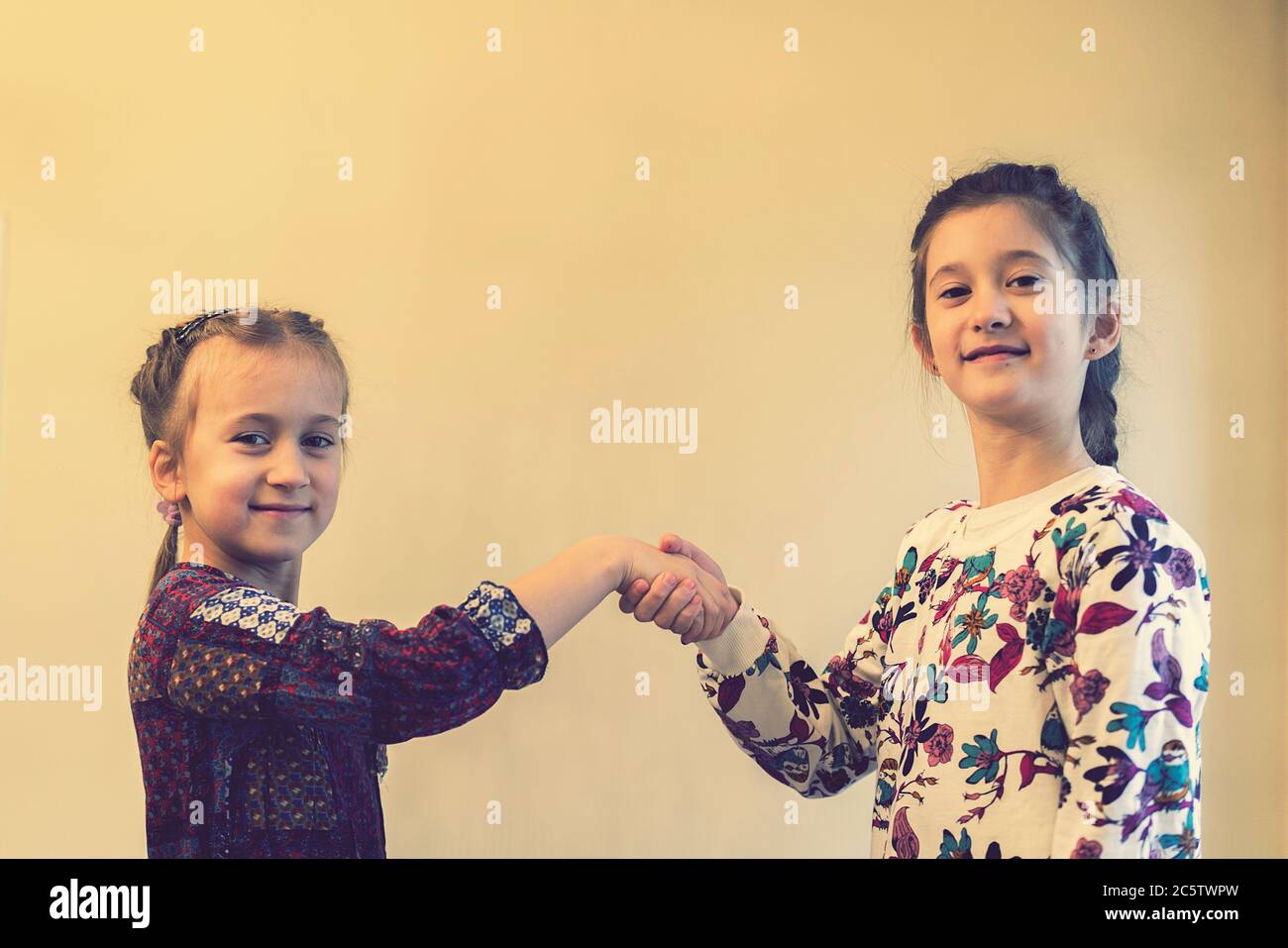 girl shaking hands. friendship and love concept. toned Stock Photo - Alamy