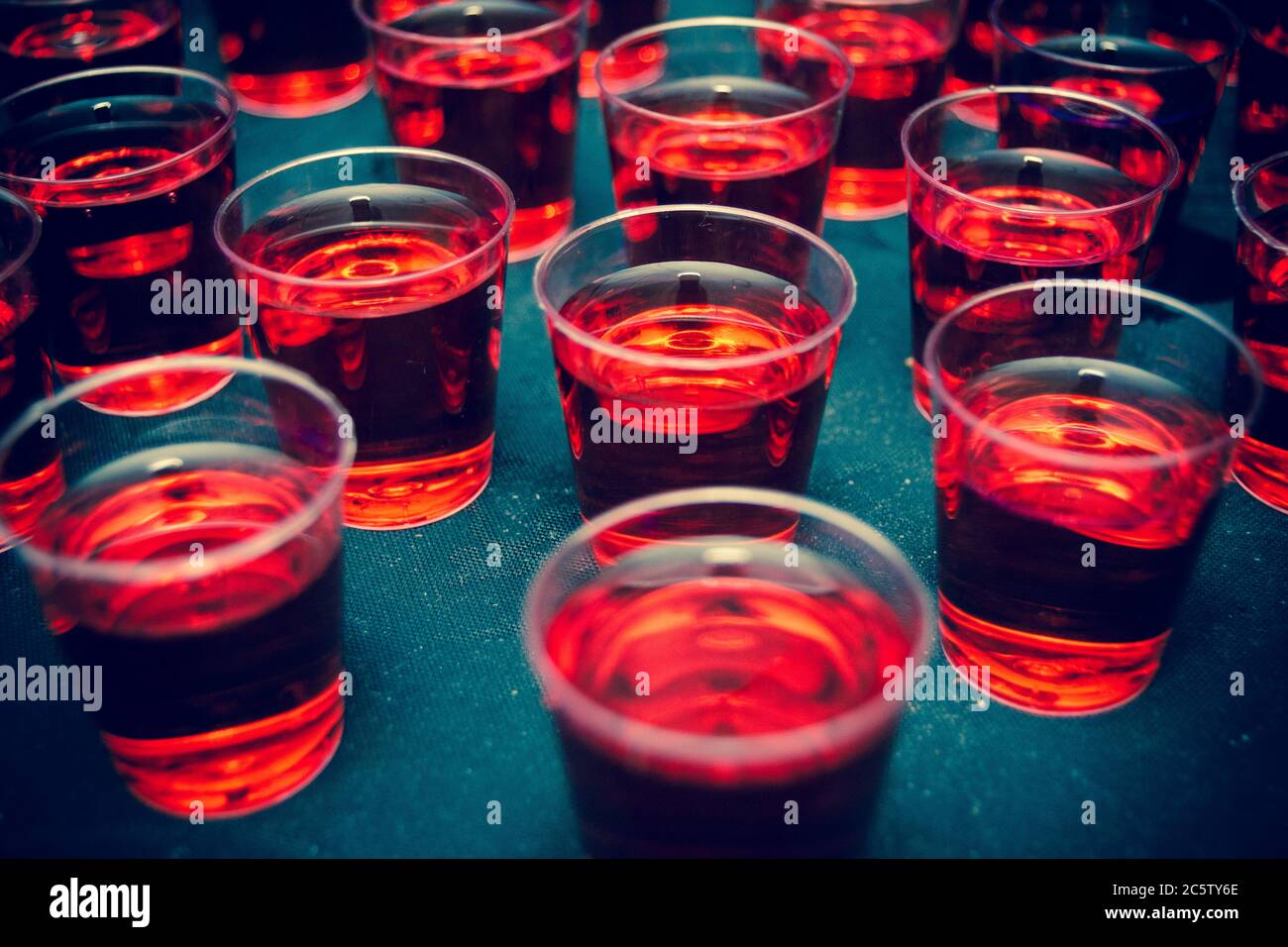 Table filled with colorful shots full of heavy liqueur Stock Photo - Alamy