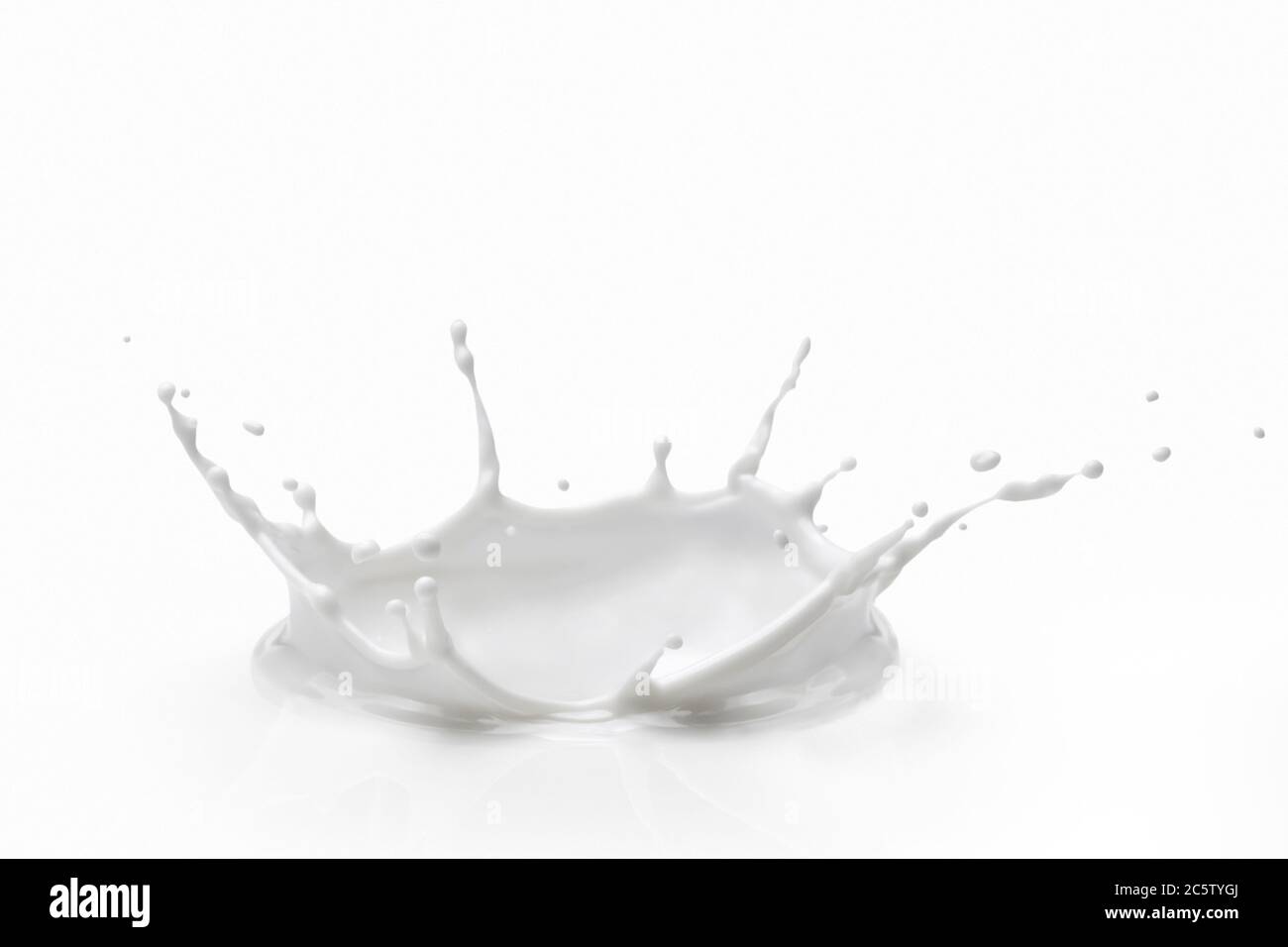 Milk splash on white background. Close up of a milk splash on white ...