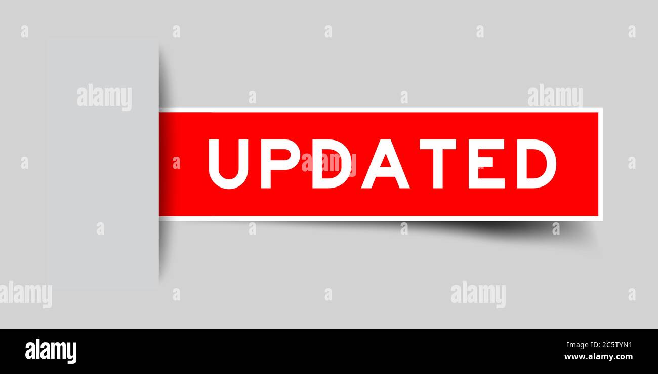 Inserted red color sticker label with word updated on gray background ...