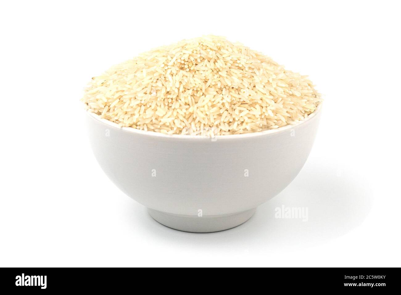 White bowl with a beautiful slide of rice grains. On white background ...