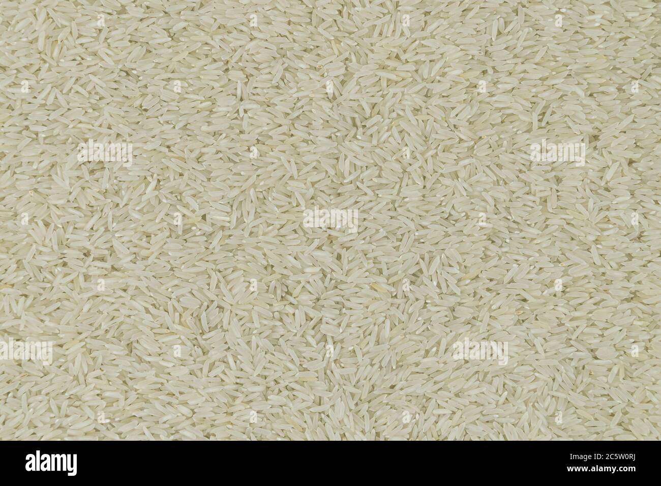 Large scattering of rice grains. Flat lay snapshot Stock Photo - Alamy