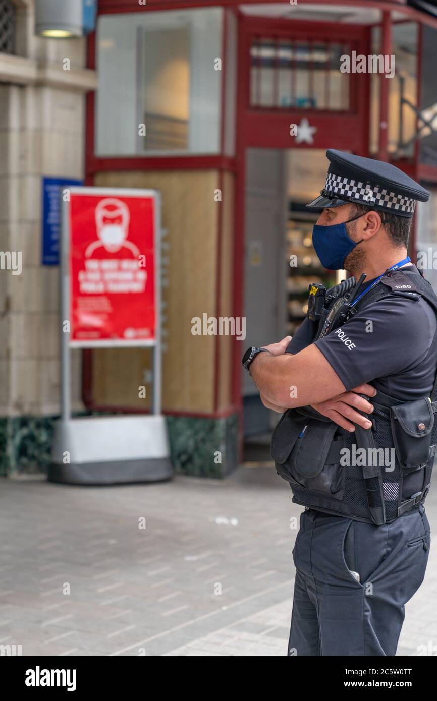 LONDON, ENGLAND - JULY 3, 2020: Male Police Officer on duty outside ...