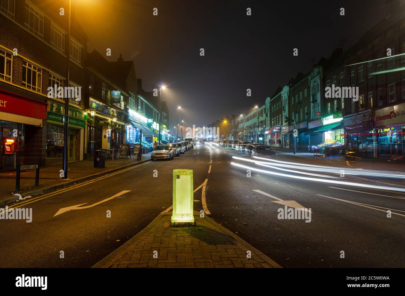 Empty streets lit by lanterns at night with streaks of light Stock ...