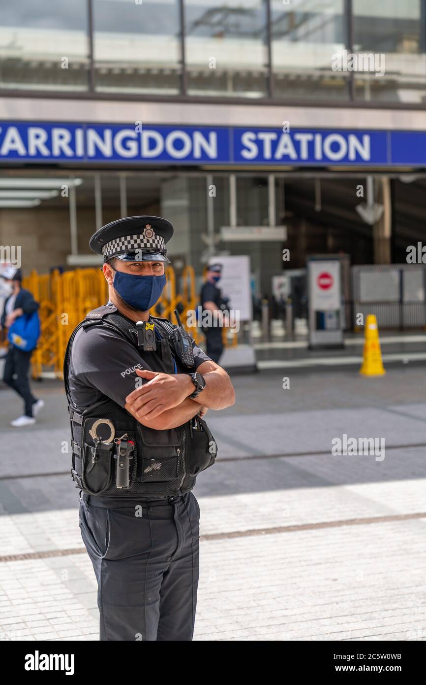 LONDON, ENGLAND - JULY 3, 2020: Male Police Officer on duty outside ...