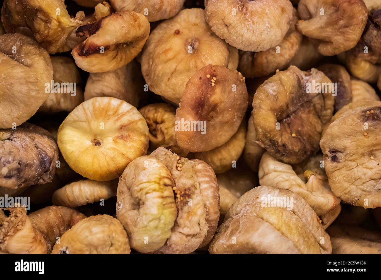 Selling dried figs in a supermarket. Close up fruits for a healthy diet ...