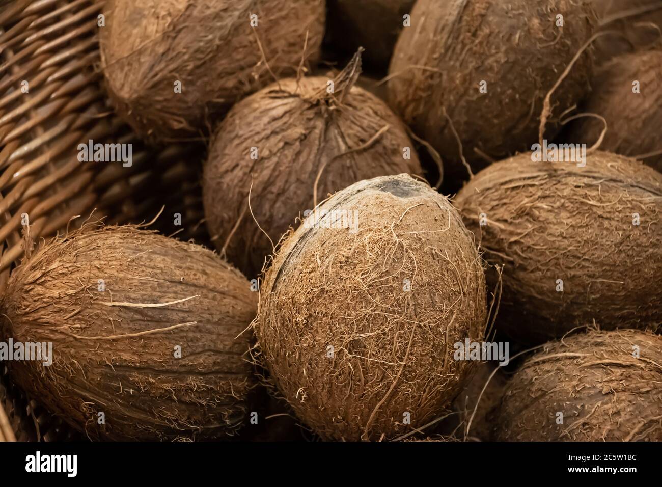 Selling ripe coconuts at the farmers market. Tropical fruits for ...