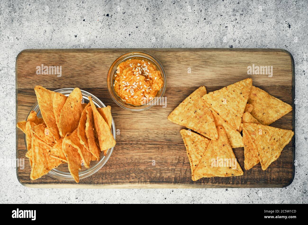 Corn cheese, snacks with sauce on a wooden stand. Beer snack, dish on ...