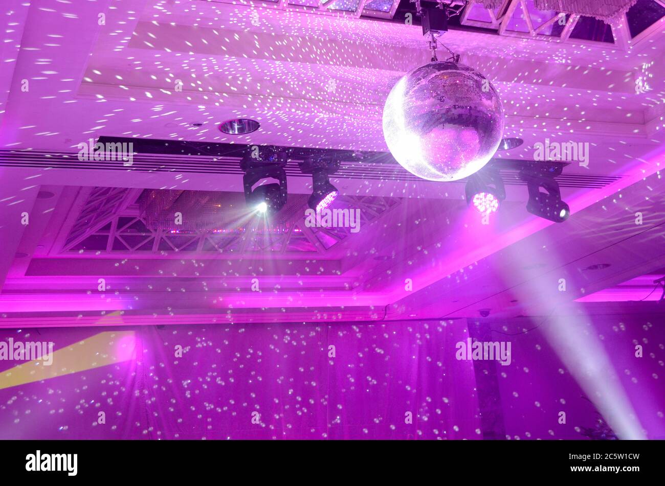 Disco ball reflecting light during the dance Stock Photo - Alamy