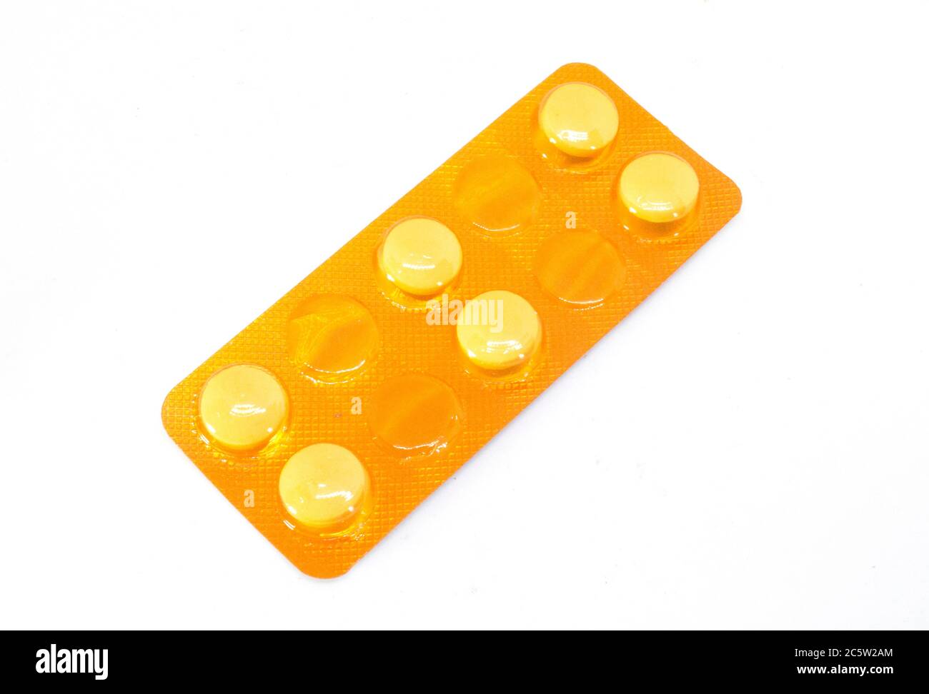 Medicine tablets image in yellow color pack Stock Photo - Alamy
