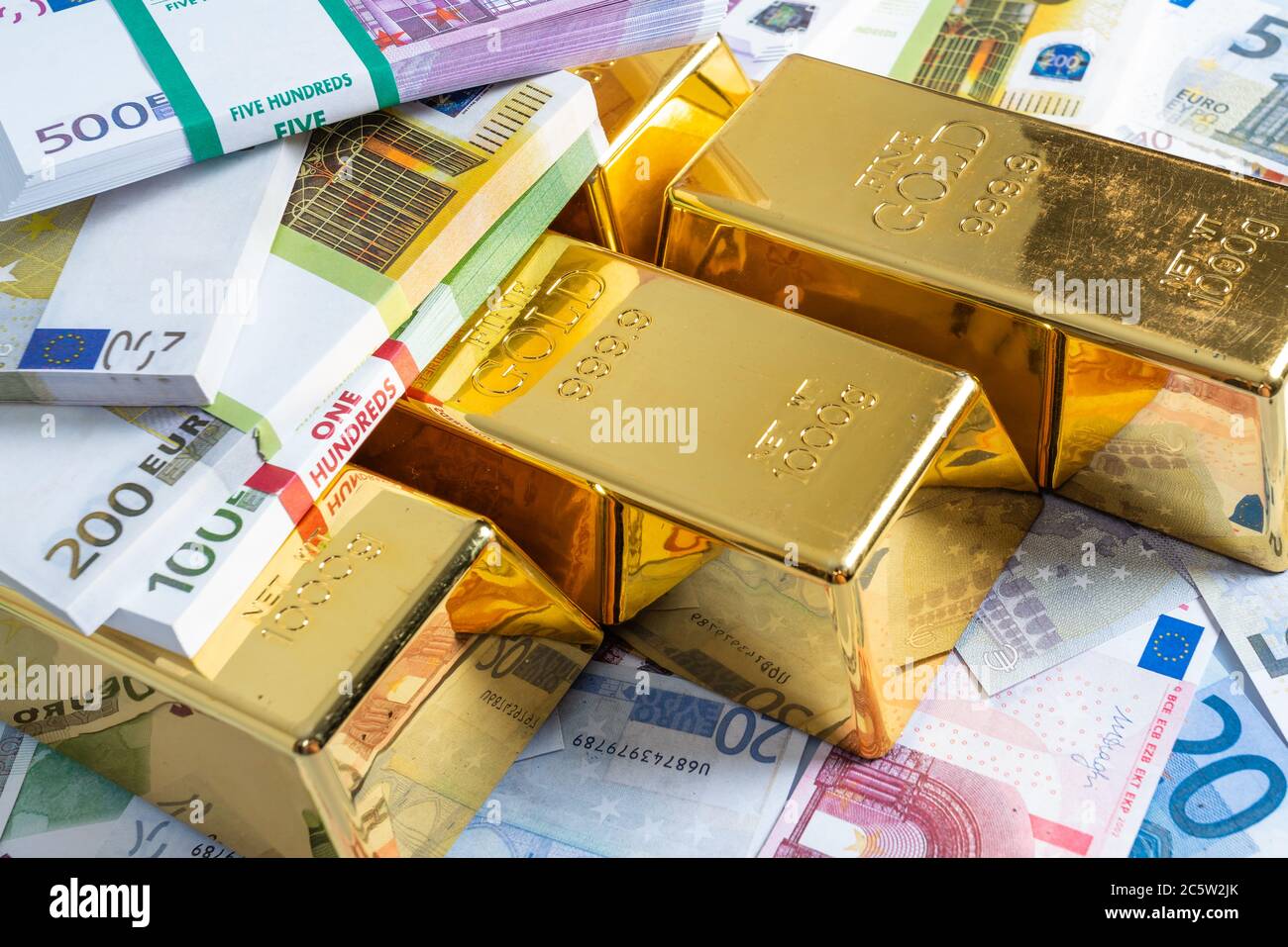 Gold Bullion with euro banknote background Stock Photo - Alamy