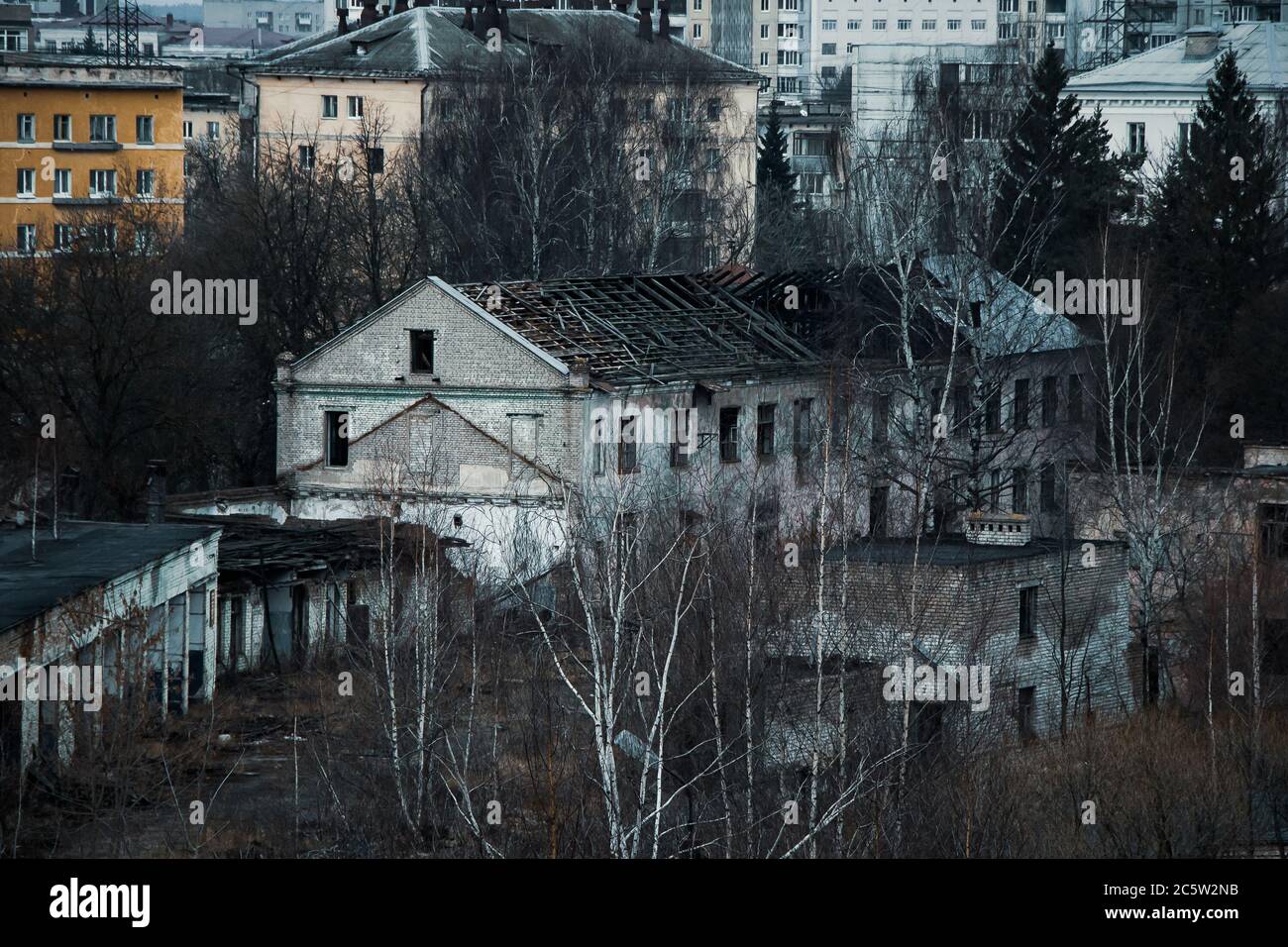 View of the gloomy abandoned buildings of the old factory Stock Photo ...