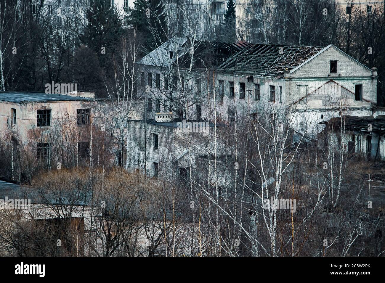 View of the gloomy abandoned buildings of the old factory Stock Photo ...