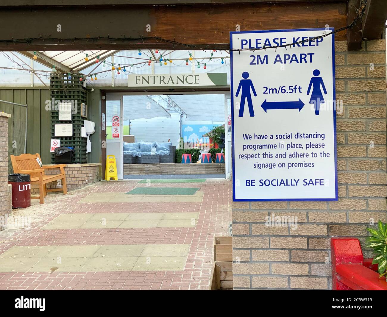 Social distancing sign for shop customer keep 2m apart Stock Photo - Alamy