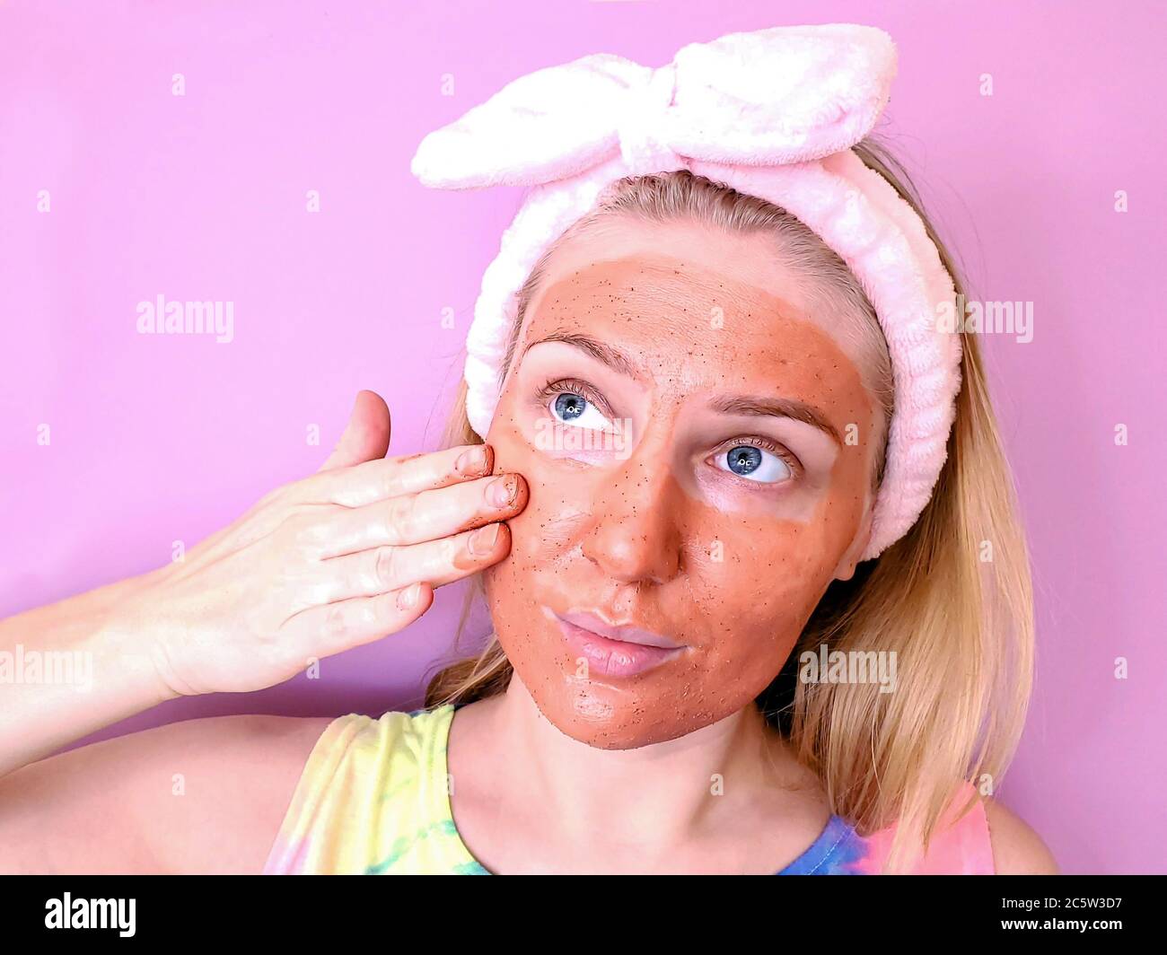 Touching a mask hi-res stock photography and images - Alamy