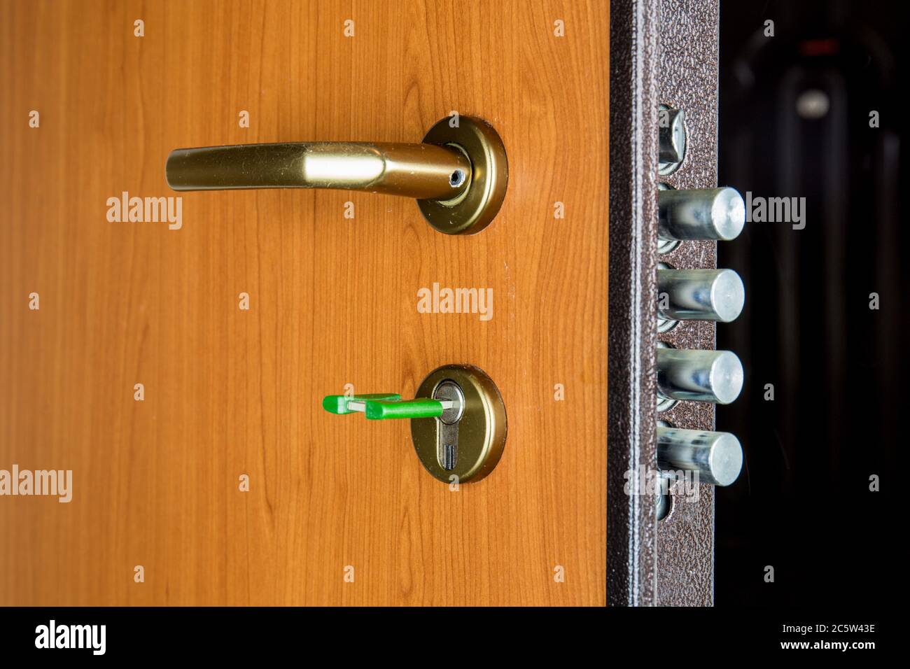 Armored front door, security lock with key. Home security Stock Photo ...