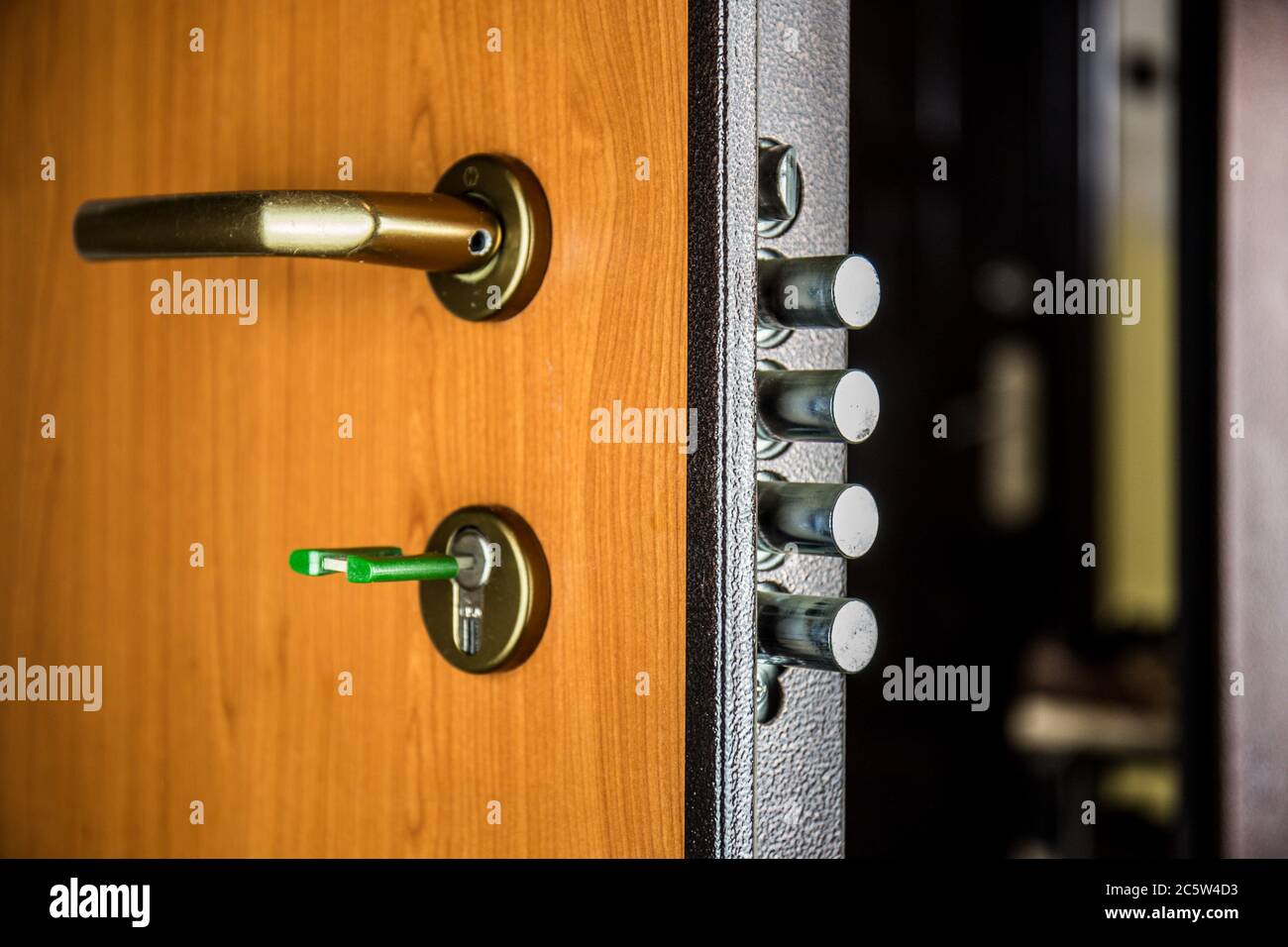 Armored front door, security lock with key. Home security Stock Photo ...