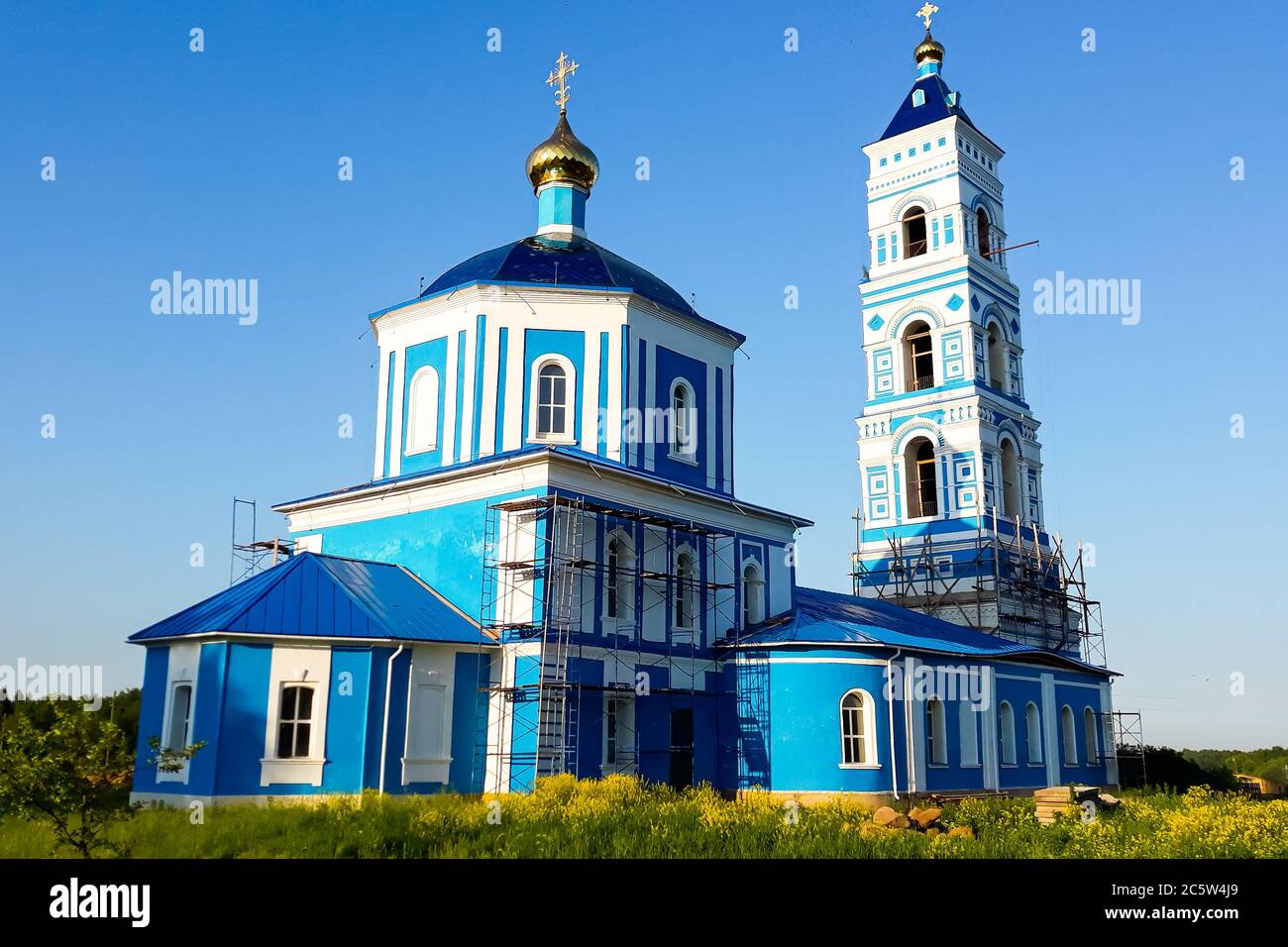 Beautiful christian church with golden domes among green trees Stock ...