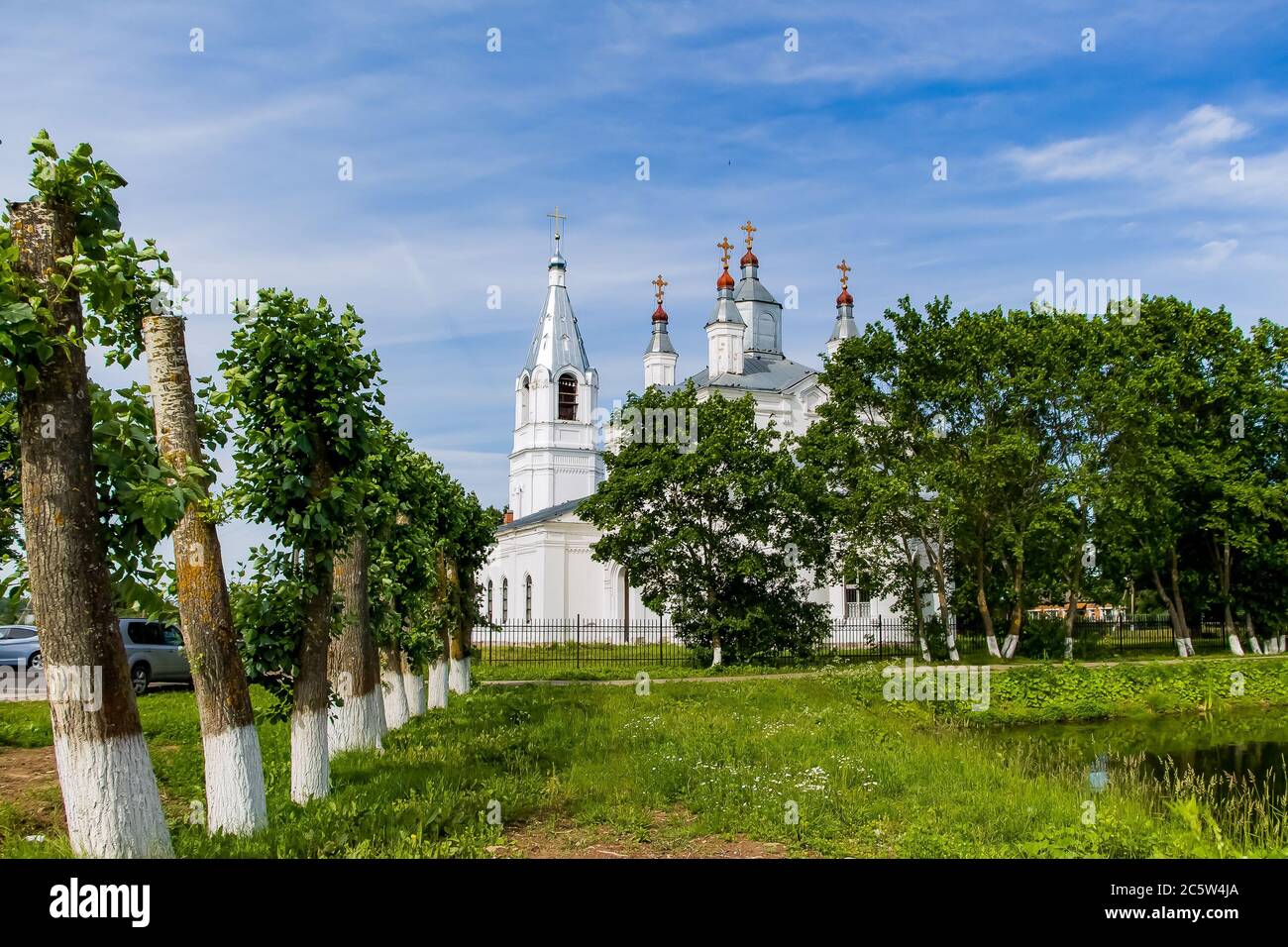 Beautiful christian church with golden domes among green trees Stock ...