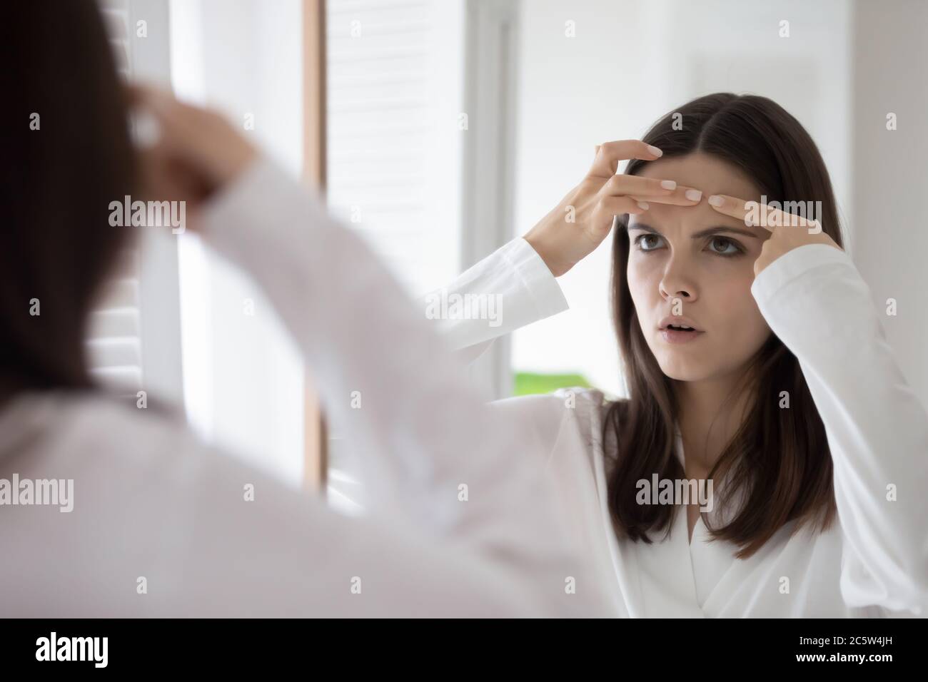 Woman face mirror blemish hi-res stock photography and images - Alamy