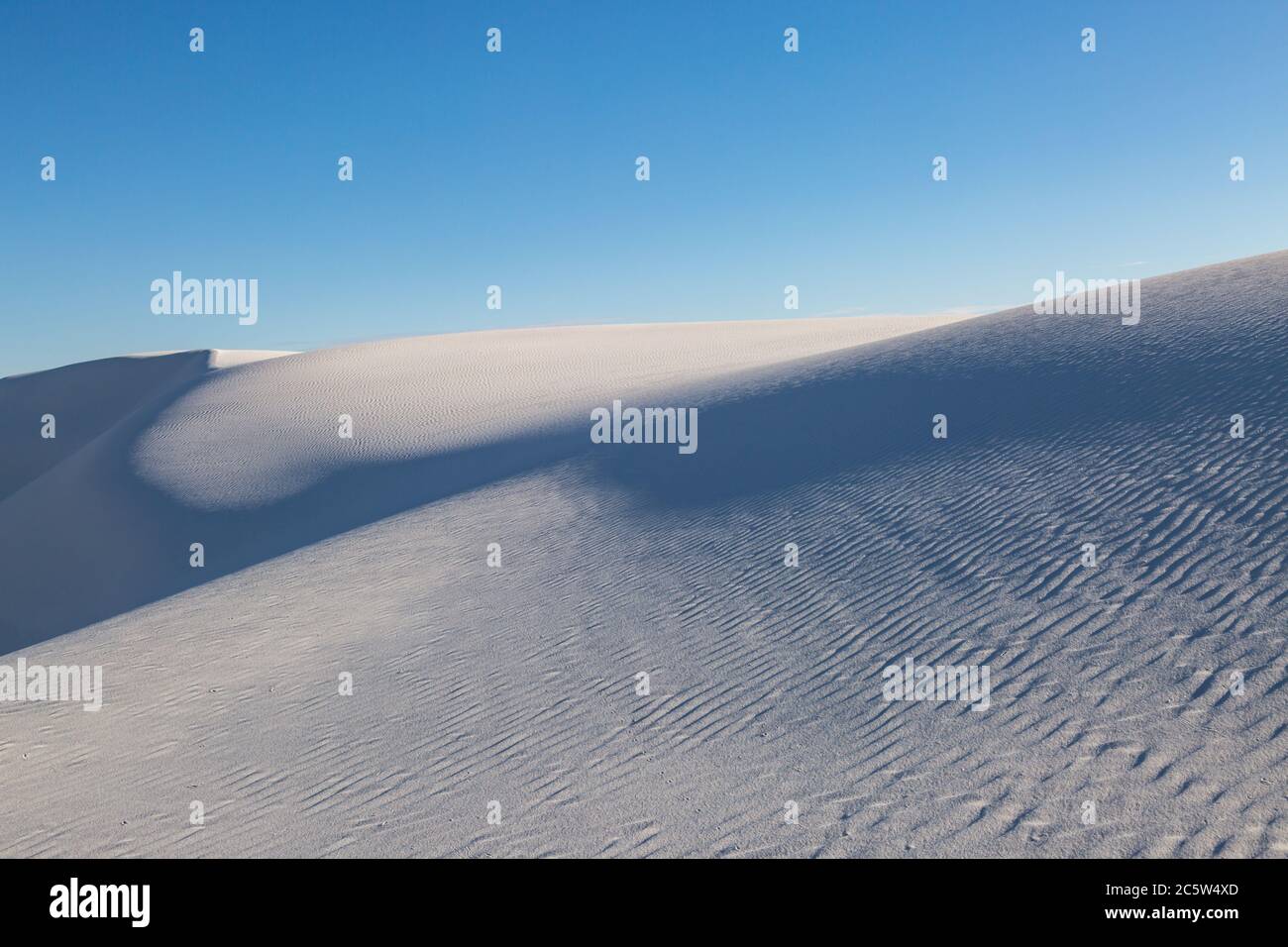 Contrasting blue sky and white gypsum sand, in White Sands National ...