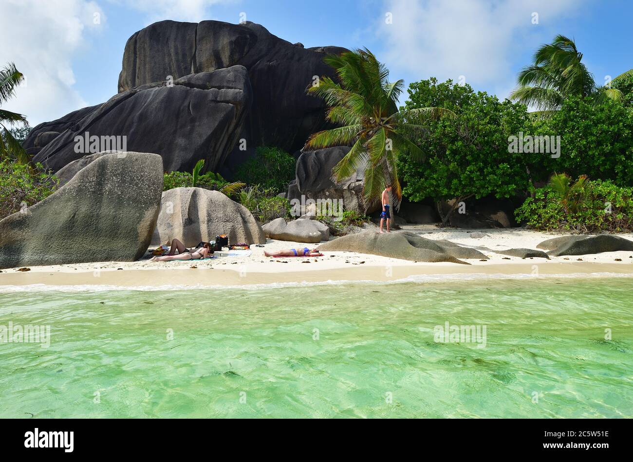 La Digue, Seychelles - July 2, 2011: Tourist family relaxing on the ...