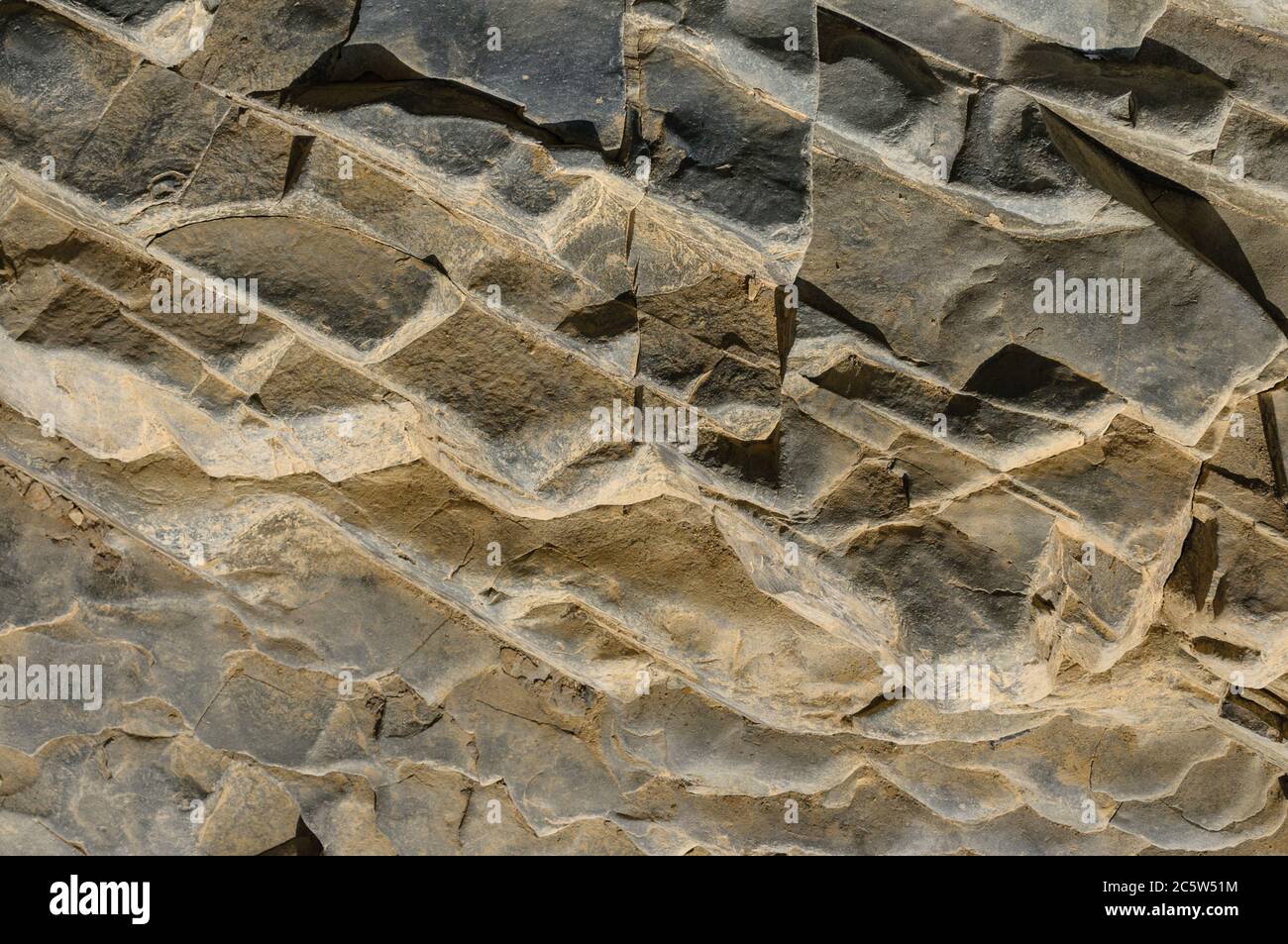 Texture of a dark yellow granite stone or background for design. The ...