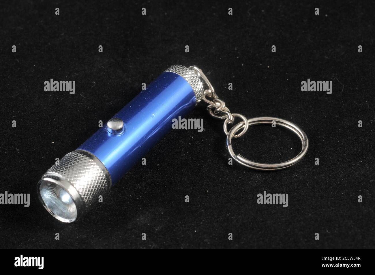 One Blue Aluminum Led Torch on a Black Background Stock Photo - Alamy