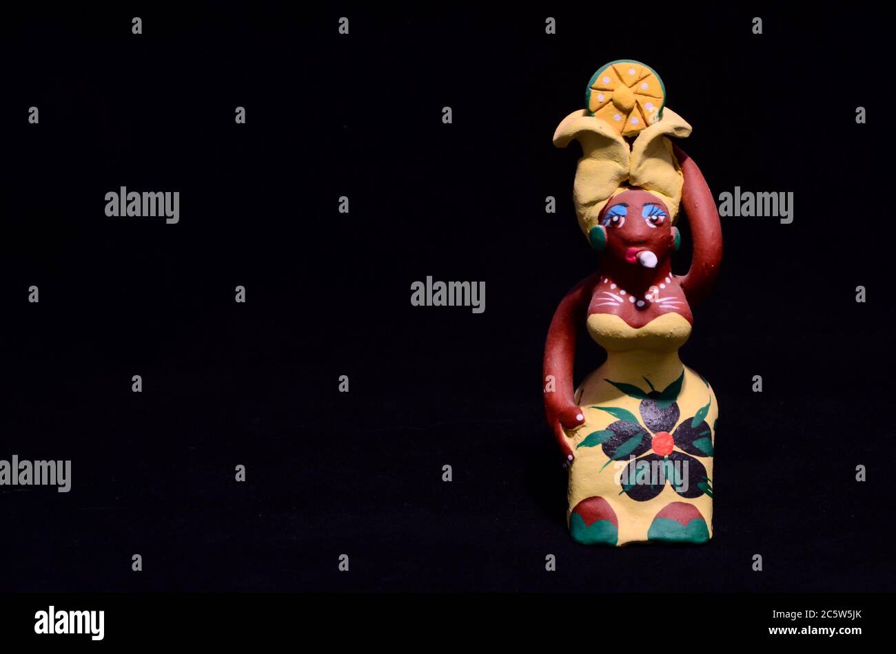 Clay Handmade Statue of a Cuban Woman on Black Background Stock Photo ...