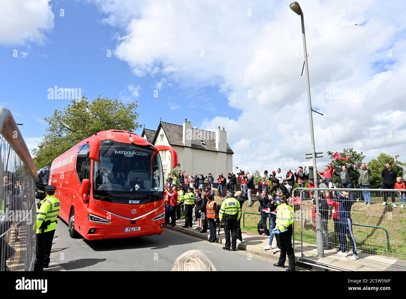 Fans outside the ground as the Liverpool team bus arrives at Anfield ...