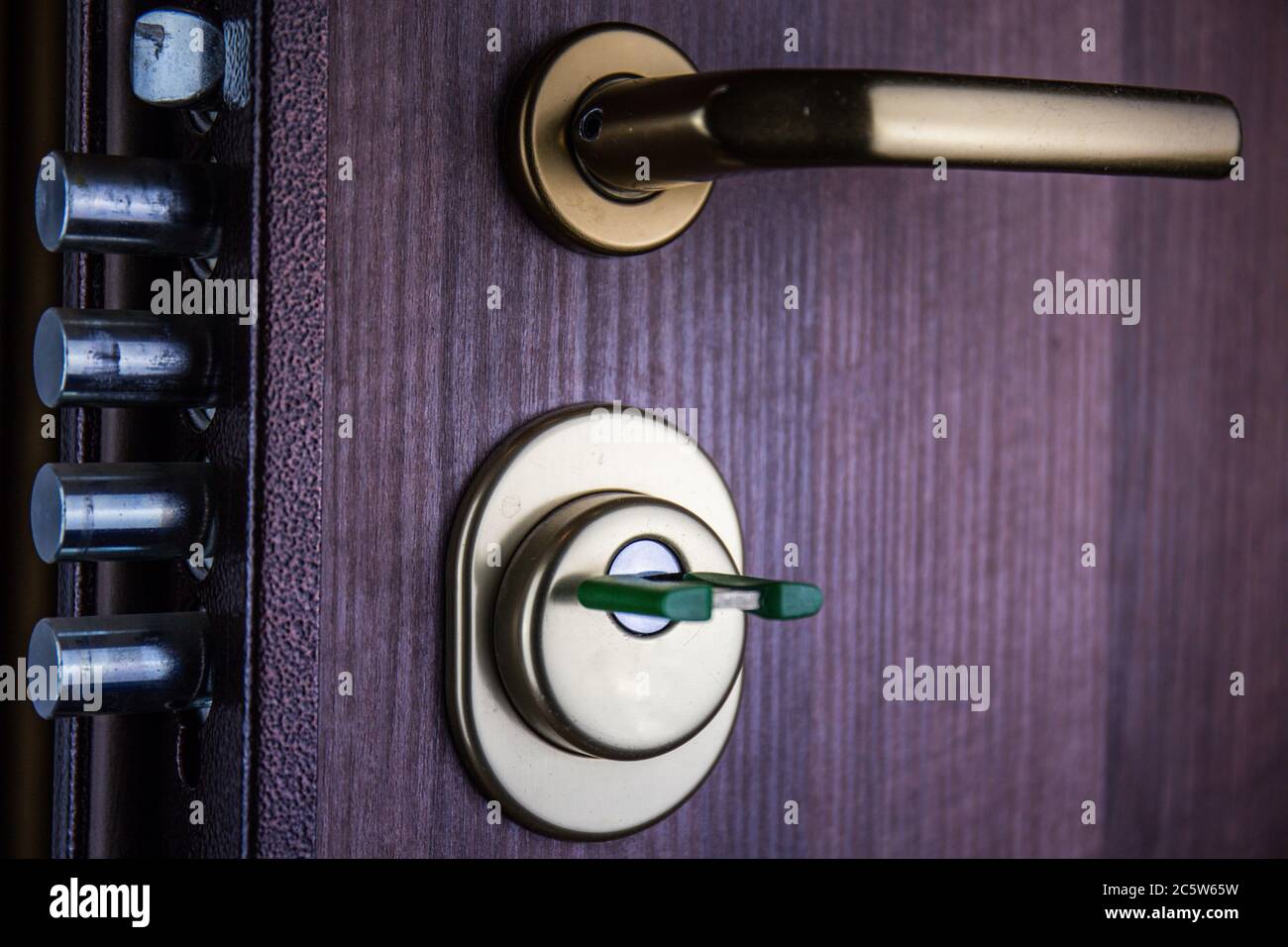 Armored front door, security lock with key. Home security Stock Photo ...