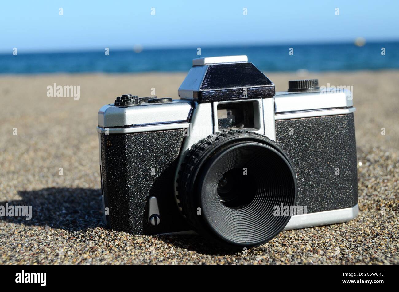 Old Photo Camera on the Sand Beach Stock Photo - Alamy