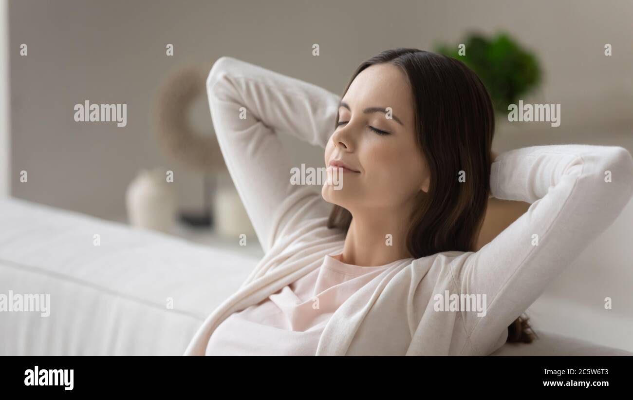 Close up dreamy beautiful woman taking nap on cozy couch Stock Photo ...