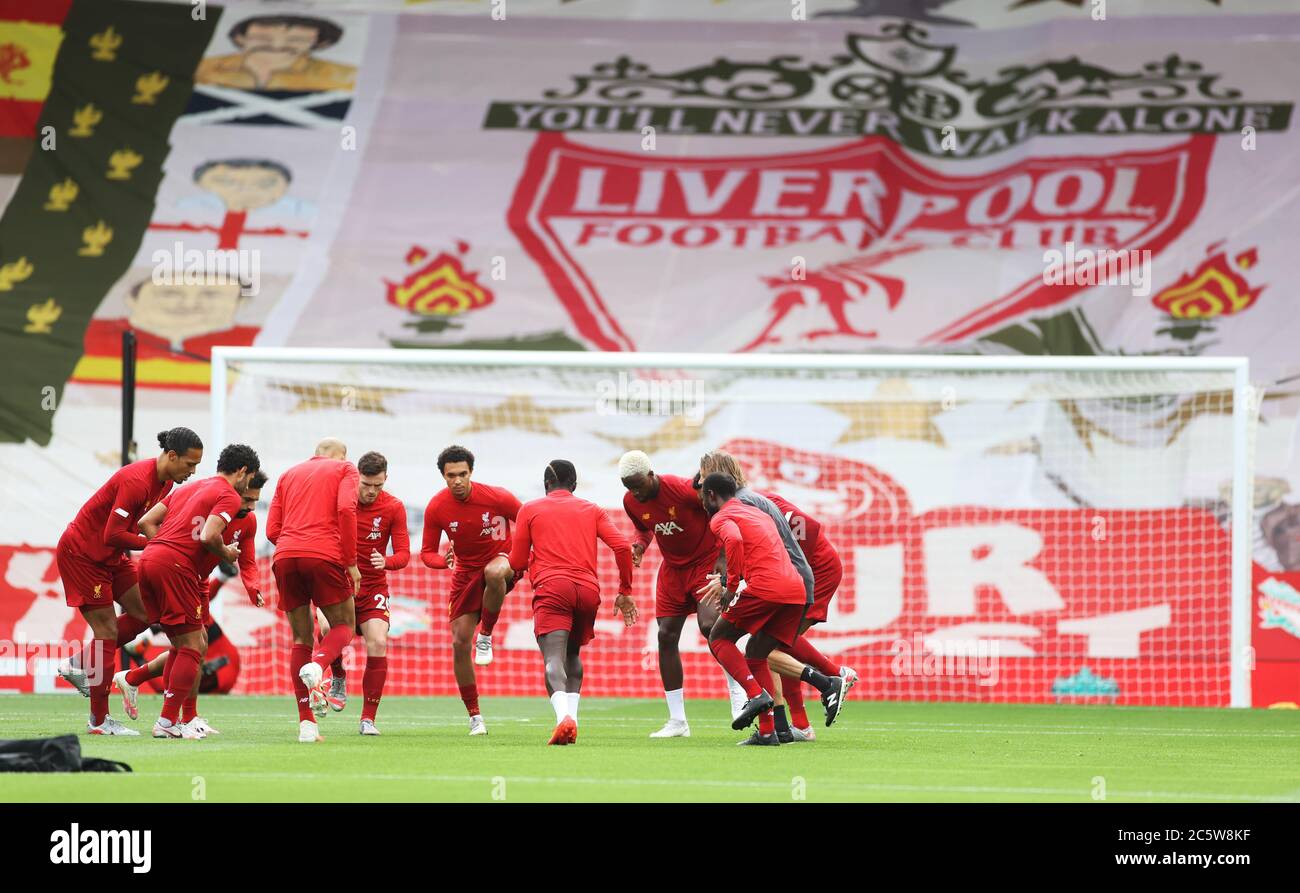 Liverpool players warm up before the Premier League match at Anfield ...