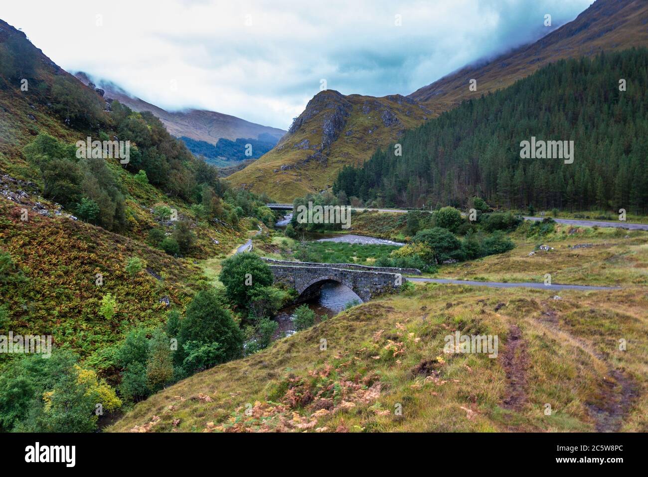 Thomas Telford's stone arch bridge, and the modern A87 main road, cross ...