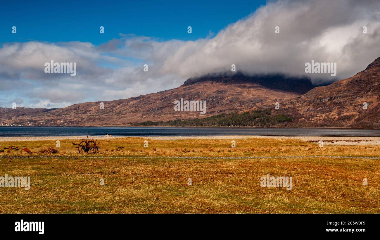 The summit of Beinn Alligin mountain is shrouded in cloud above Upper ...