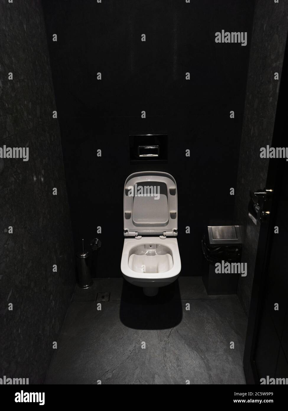 stylish beautiful toilet in a black interior Stock Photo - Alamy