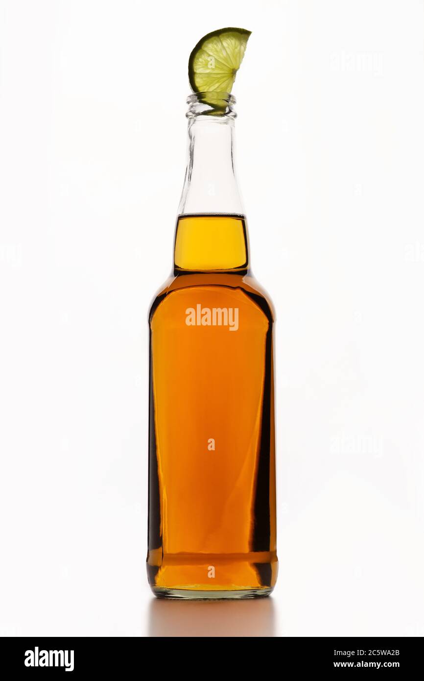 Beer to serve client. Light ale in bottle with lime on white background ...