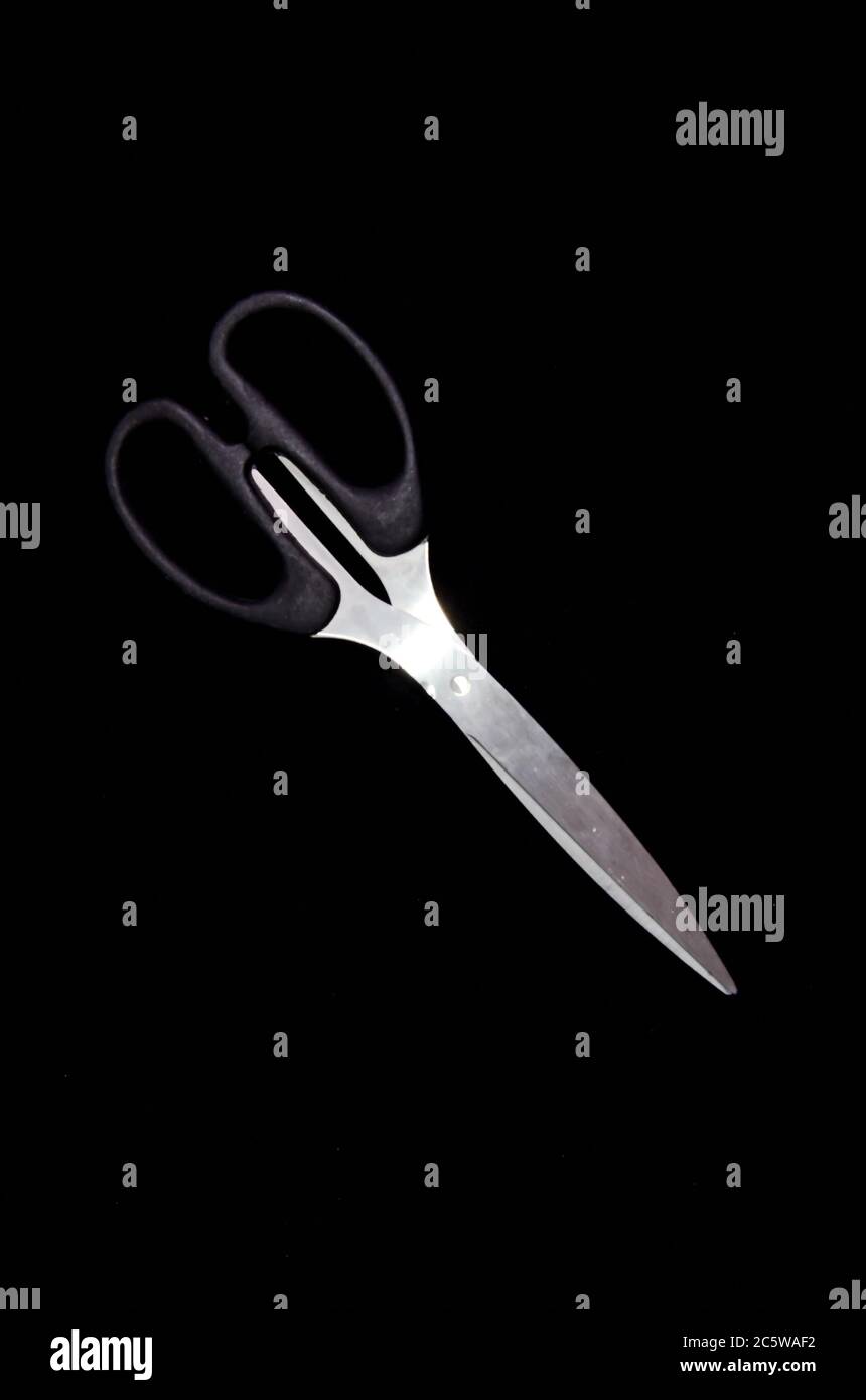 Classic Metal Scissors Isolated on a Black Background Stock Photo - Alamy
