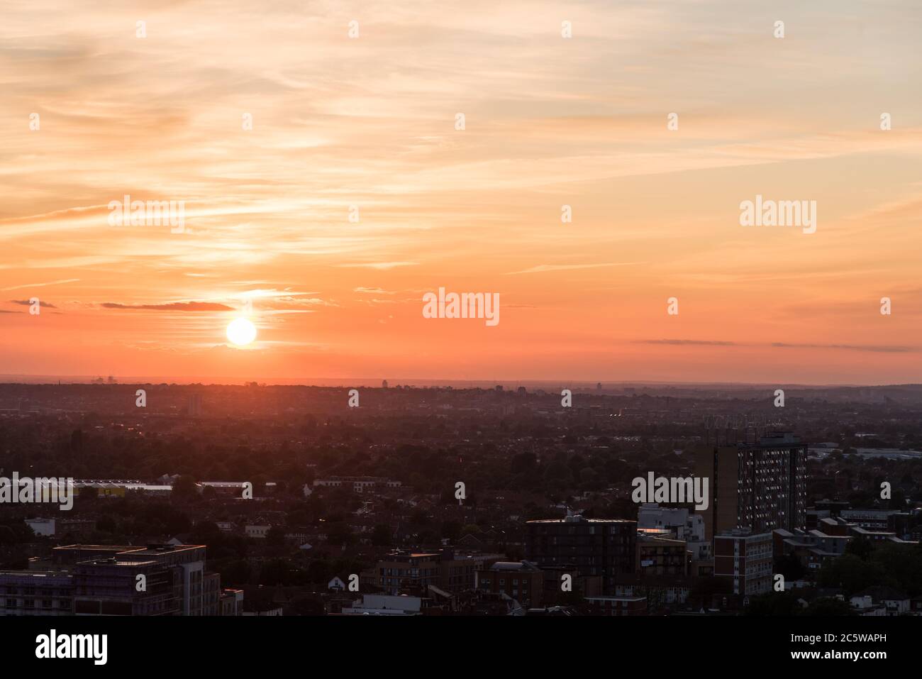 Cityscape with moody sunset sky hi-res stock photography and images - Alamy
