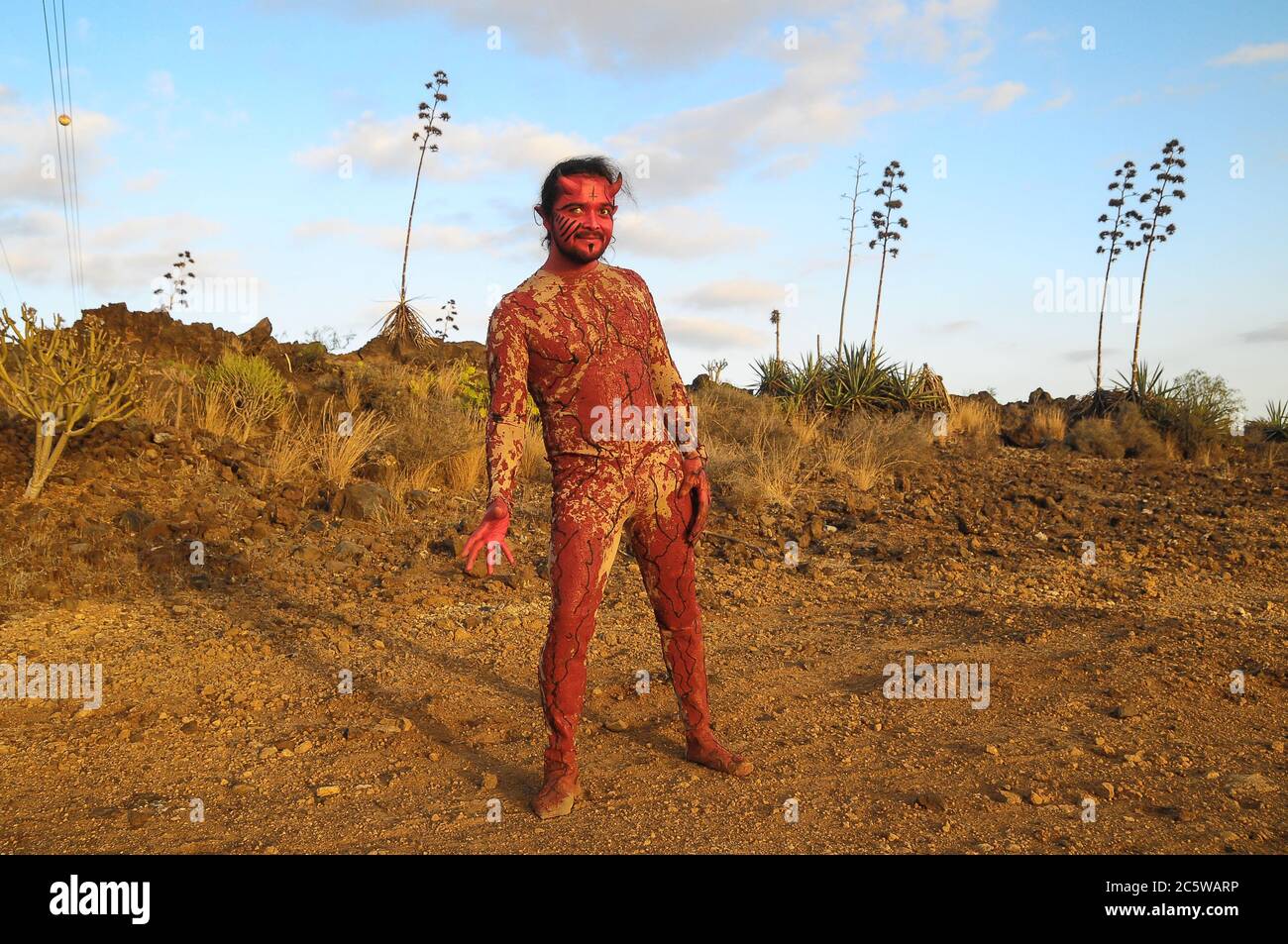 Latin American Man with Long Hairs Masked as a Devil in the Desert ...